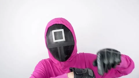 Squid Game pink guard dancing with hands... | Stock Video | Pond5