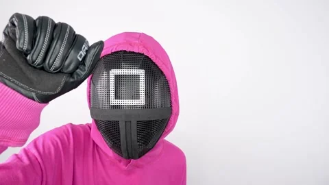 Squid Game pink guard knocking on camera... | Stock Video | Pond5