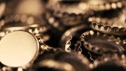 Stack of beer bottle caps on rotating st... | Stock Video | Pond5