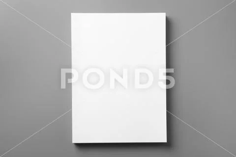 Stack of blank paper sheets for brochure on grey background, top view ...