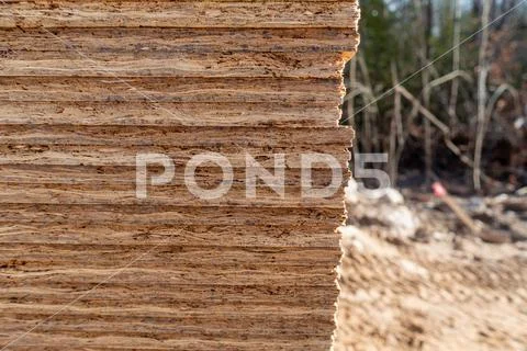 Stack of Building Lumber at Construction Site Stock Photo #154180110