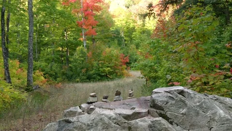 Stack of Cairns stones, Autumn deciduous... | Stock Video | Pond5
