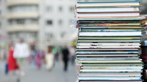 Stack of colorful books standing in a ci... | Stock Video | Pond5