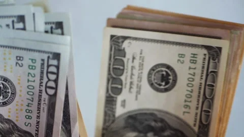 A stack of crisp, dollar bills, held in ... | Stock Video | Pond5