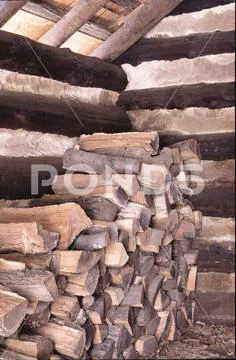 Photograph: Stack of Firewood logs inside cabin #139059712