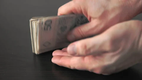 Stacking paper banknotes into one bundle... | Stock Video | Pond5