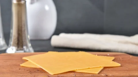 Cheddar Slices Stock Footage ~ Royalty Free Stock Videos | Pond5