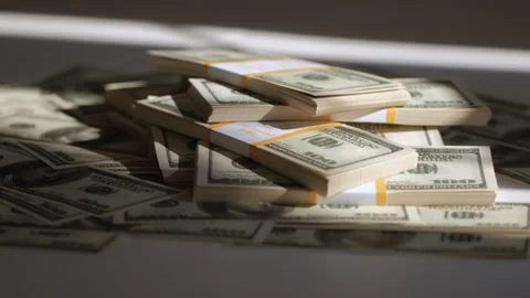 Stacks of money falling from above on th... | Stock Video | Pond5