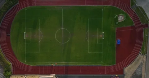 A stadium with a green football pitch an... | Stock Video | Pond5