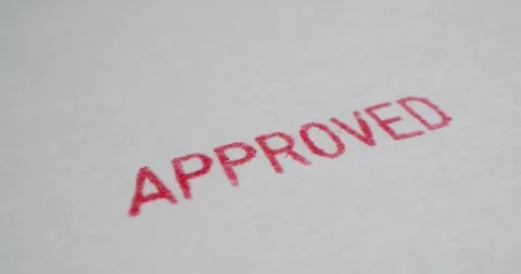 A stamp APPROVED is placed on a sheet of... | Stock Video | Pond5