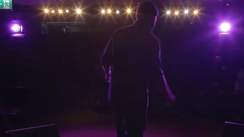 A stand-up comic on a stage | Stock Video | Pond5