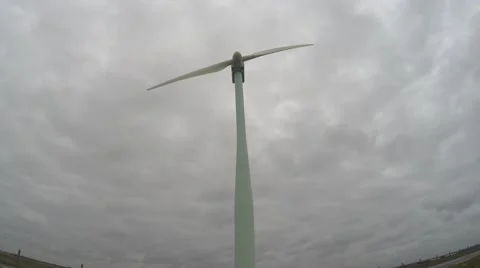 Standing in front of two blade wind turb... | Stock Video | Pond5