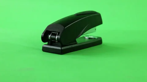 stapler turning on green screen | Stock Video | Pond5
