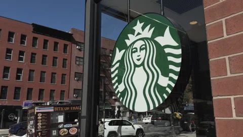 Starbucks Coffee logo in window of corne... | Stock Video | Pond5