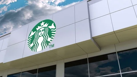 Starbucks logo on the modern building fa... | Stock Video | Pond5
