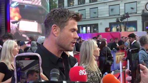 Stars of Transformers One walk the red c... | Stock Video | Pond5