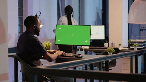 Startup worker analyzing greenscreen on ... | Stock Video | Pond5