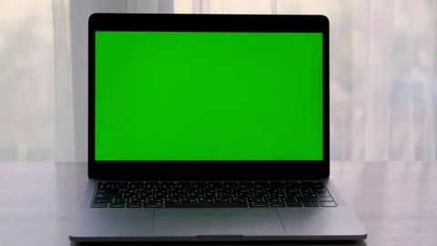 STATIC laptop computer with a key green ... | Stock Video | Pond5