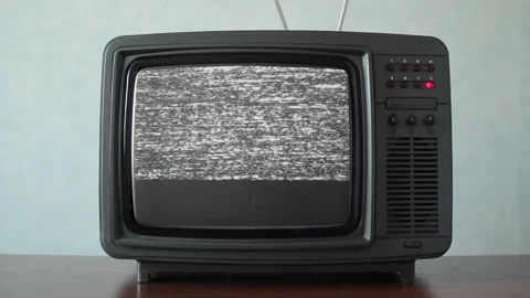 Static noise on a vintage TV set in a ro... | Stock Video | Pond5