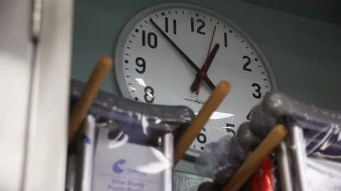 Static shot of analog clock hanging on h... | Stock Video | Pond5