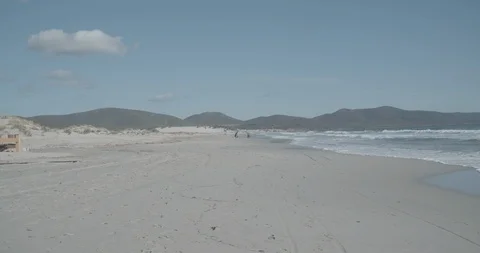 Static shot of a beach with mountains an... | Stock Video | Pond5