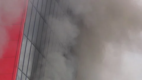 Static Shot of Fire Smoke Rising Up Buil... | Stock Video | Pond5