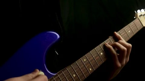 Static shot of a guitarist playing his b... | Stock Video | Pond5