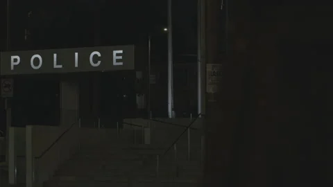 Static shot of police sign in front of b... | Stock Video | Pond5