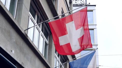 Static shot of the Swiss flag hanging fr... | Stock Video | Pond5