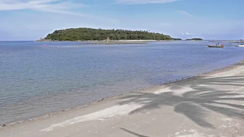 Static shot of a tropical beach with an ... | Stock Video | Pond5