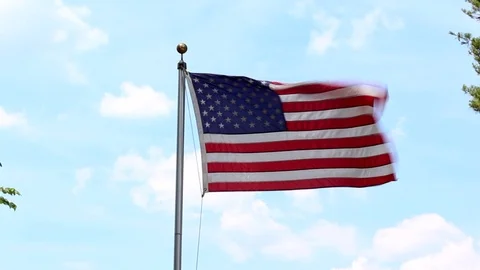 Static shot of the US flag waving in the... | Stock Video | Pond5