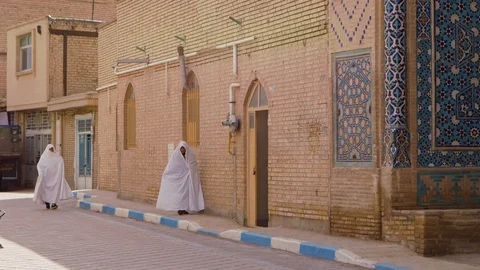 Static shot of a women walking on the st... | Stock Video | Pond5