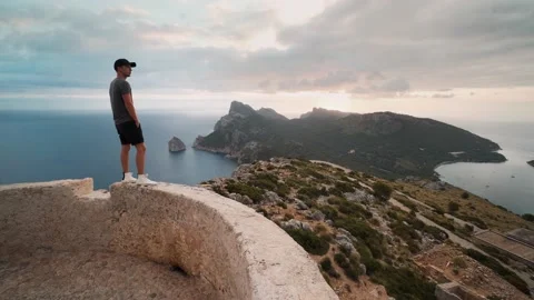 Static shot of a young man standing at t... | Stock Video | Pond5