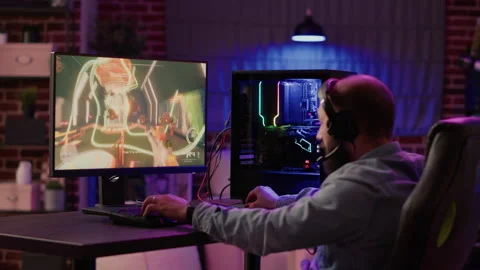 Static tripod shot of man playing online... | Stock Video | Pond5