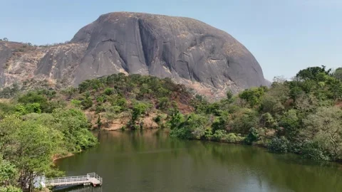 Static wide shot of Aso Rock with a lake... | Stock Video | Pond5