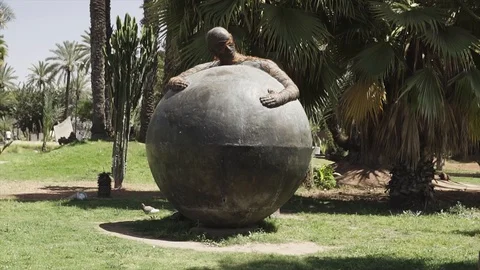 Statue of a man holding a massive ball |... | Stock Video | Pond5