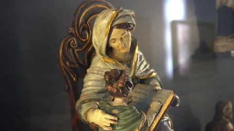 A statue of Mother Mary reading book to ... | Stock Video | Pond5