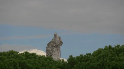 Statue of a person taking care of a woun... | Stock Video | Pond5