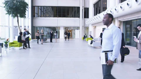 Steadicam dolly back through office foll... | Stock Video | Pond5