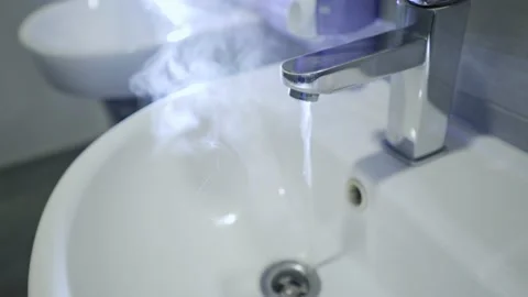 Steam from hot water in the sink. Hot ta... | Stock Video | Pond5