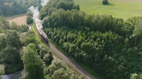 Steam train arrives at the station throu... | Stock Video | Pond5