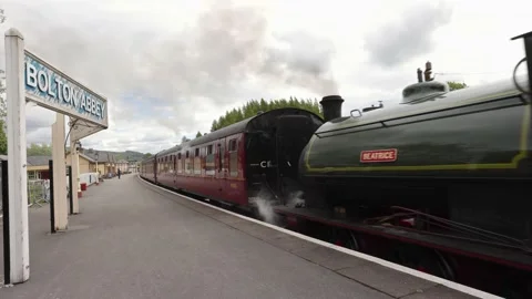 Steam train driving slowly along platfor... | Stock Video | Pond5