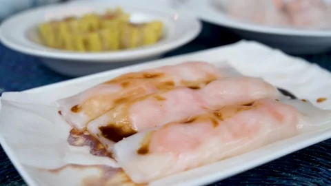 A steamed shrimp rice noodle roll dish i... | Stock Video | Pond5