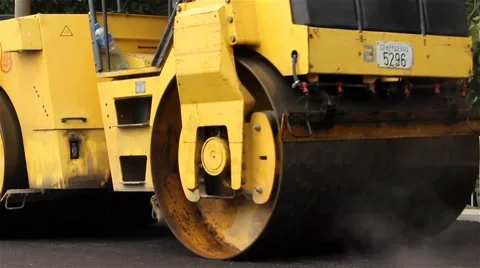 Steamroller smoothing asphalt. Road roll... | Stock Video | Pond5