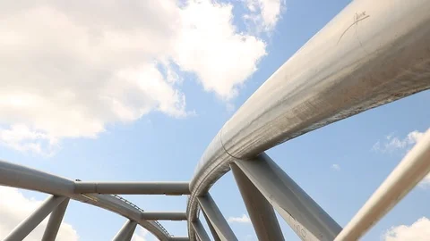 Steel pedestrian bridge over a canal in ... | Stock Video | Pond5