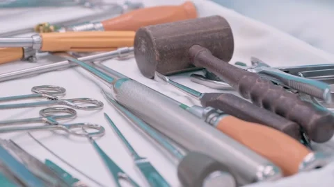 Steel sterile surgical tools lying on ta... | Stock Video | Pond5