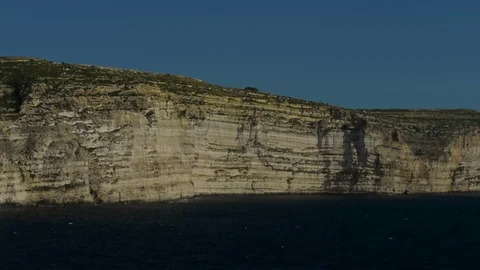 Steep limestone cliffs drop straight int... | Stock Video | Pond5