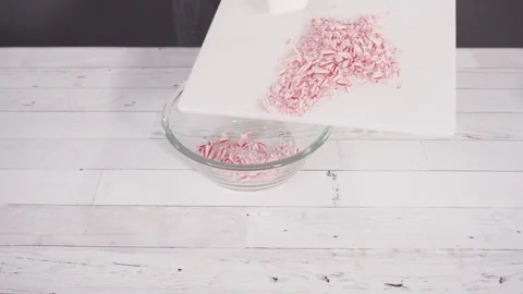 Step by step. Breaking candy cane candie... | Stock Video | Pond5