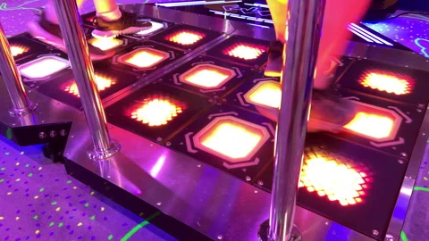 StepmaniaX dancing arcade game played by... | Stock Video | Pond5