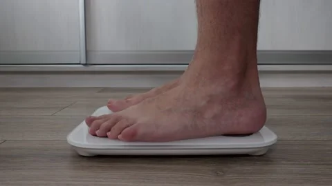 Stepping On Scale Stock Footage ~ Royalty Free Stock Videos | Pond5